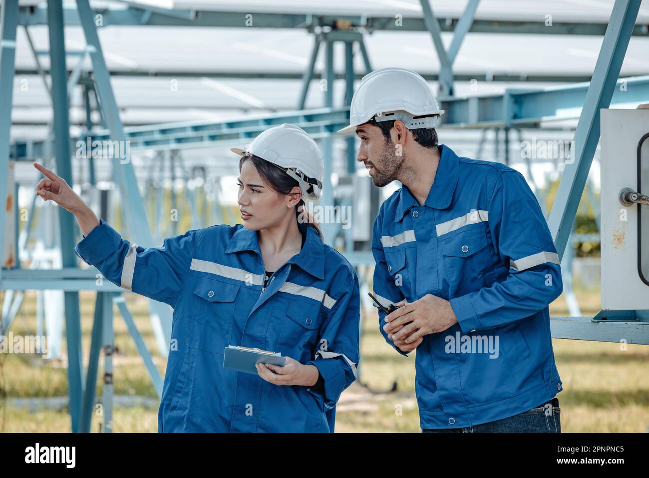 Solar electric installer and practitioner inspect electrical systems ...