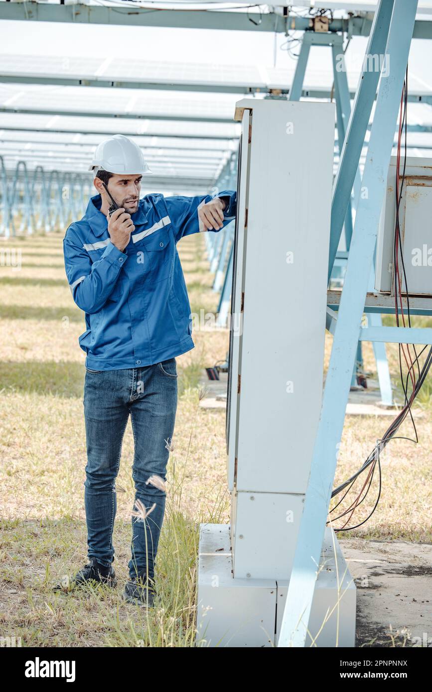 Solar electric installer and practitioner inspect electrical systems ...