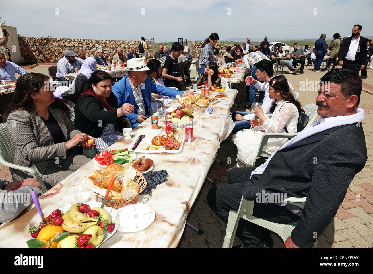 Yazidi families eat various dishes they made in their homes and left ...