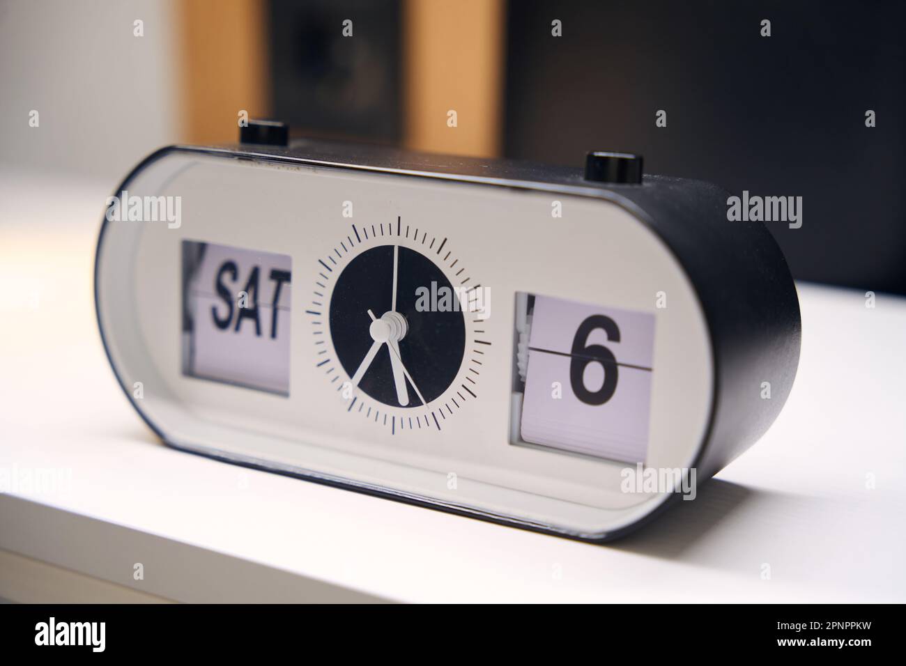 On the bedside table there is a modern electronic alarm clock Stock ...