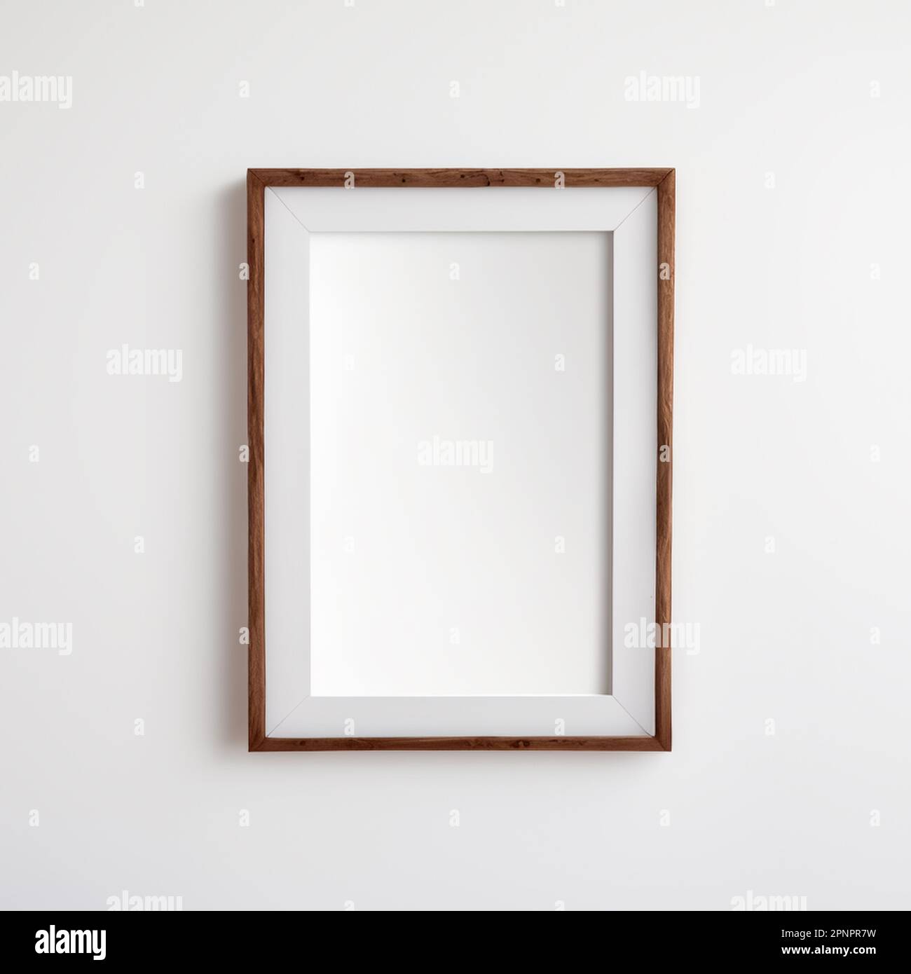 Wooden picture frame with vertical shape on a white wall mockup for ...