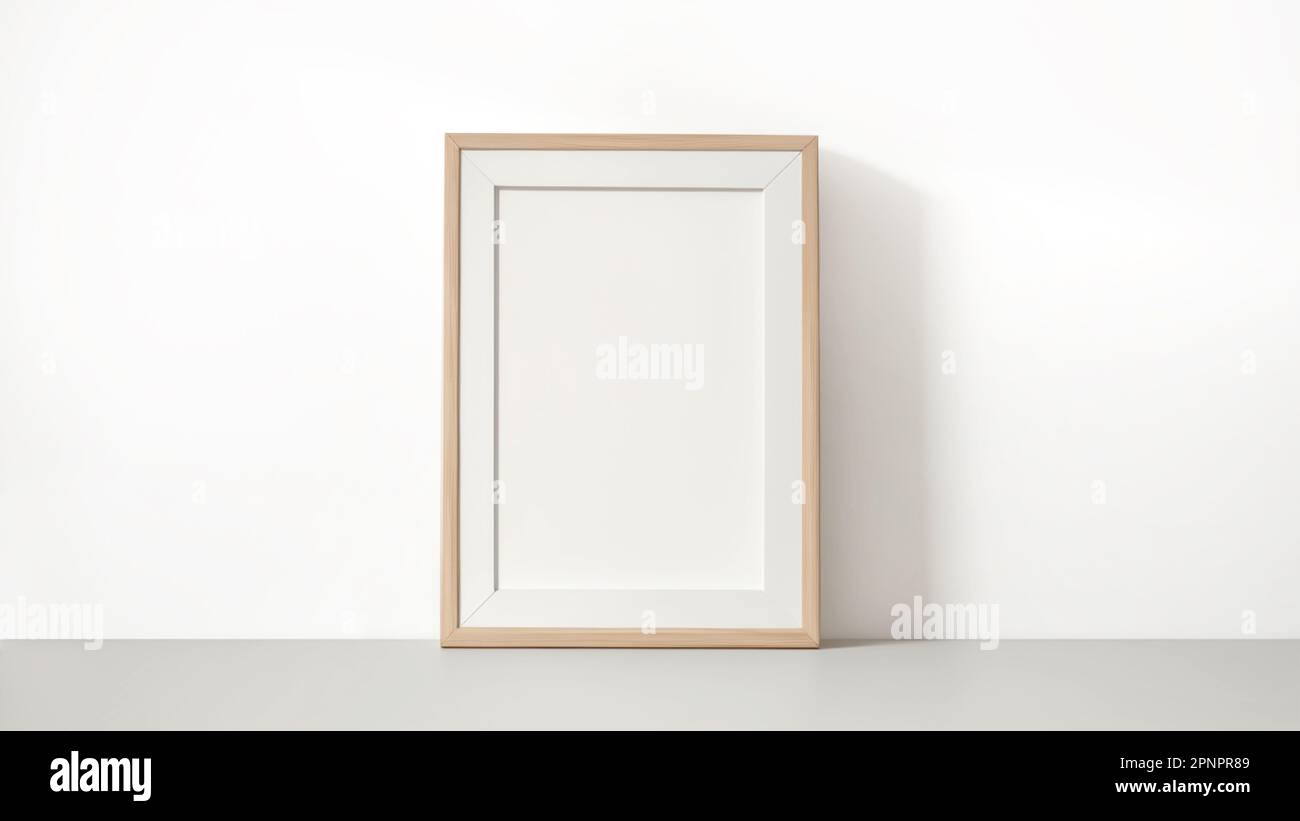 Wooden frame with rectangular vertical shape standing on a white wall ...