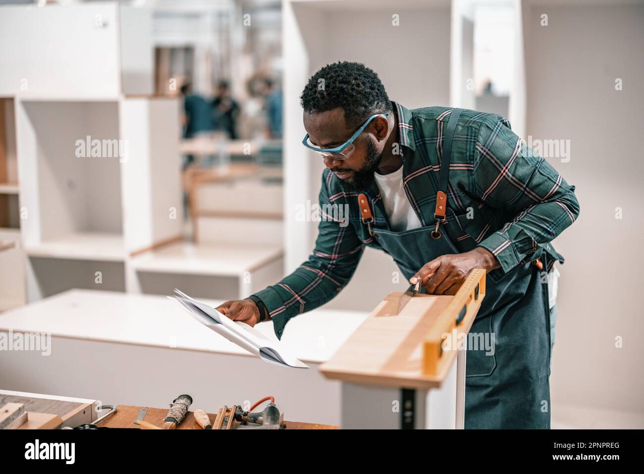 Carpenters get order via digital device , analyze blueprint, measure ...