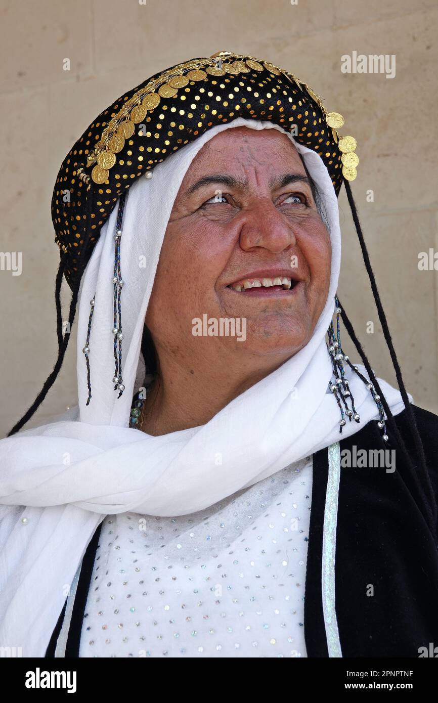 A Yazidi woman participates in the celebration of the Red Wednesday ...