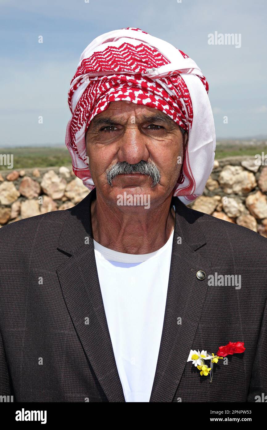 A Yazidi man is seen attending the celebration in Bacinê village. One ...