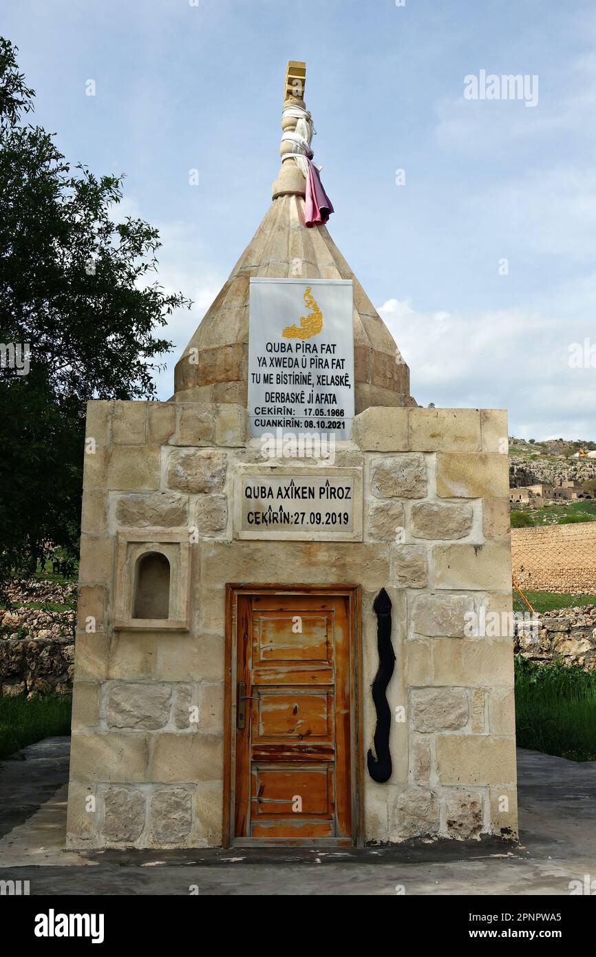 A Yazidi shrine is seen in Kiwêxê village and the figure of a snake on ...
