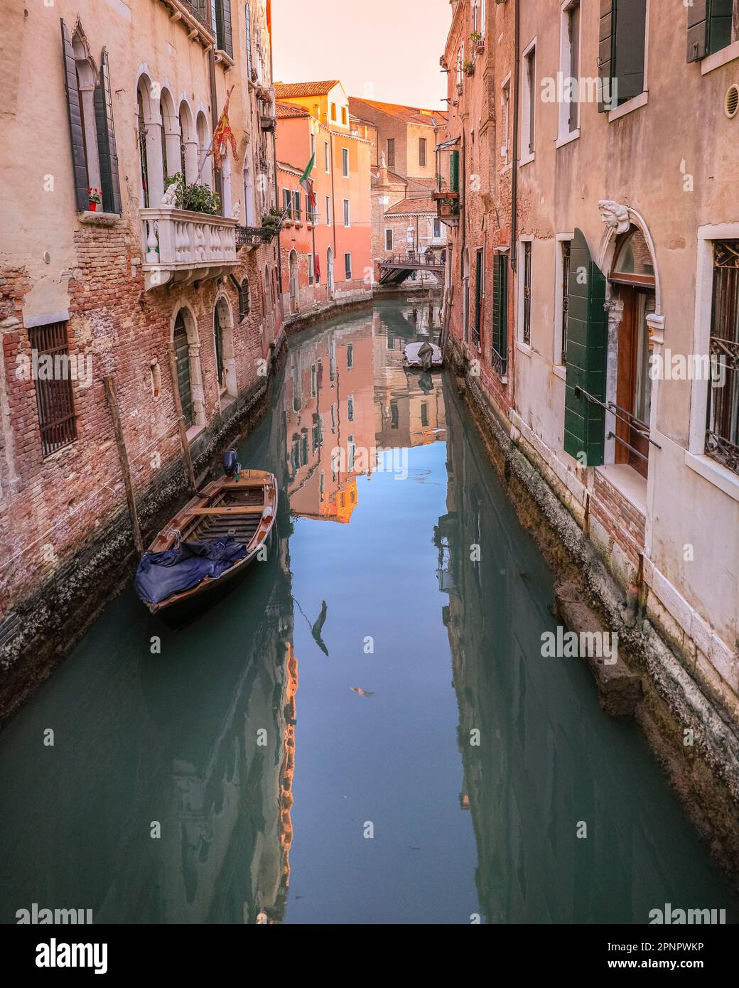 Venice, quiet small canal and historic architecture in the evening ...