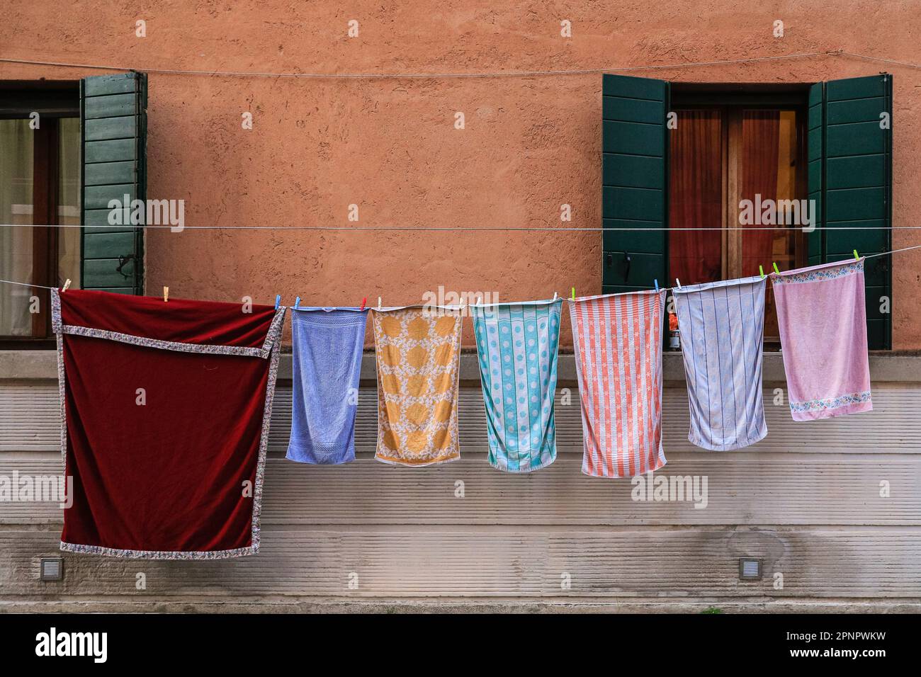 Burano Island, Venice, traditional outdoor washing line outside house ...