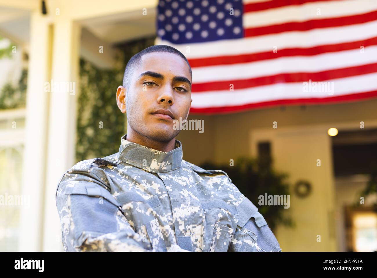 Portrait of biracial male american soldier wearing military uniform ...