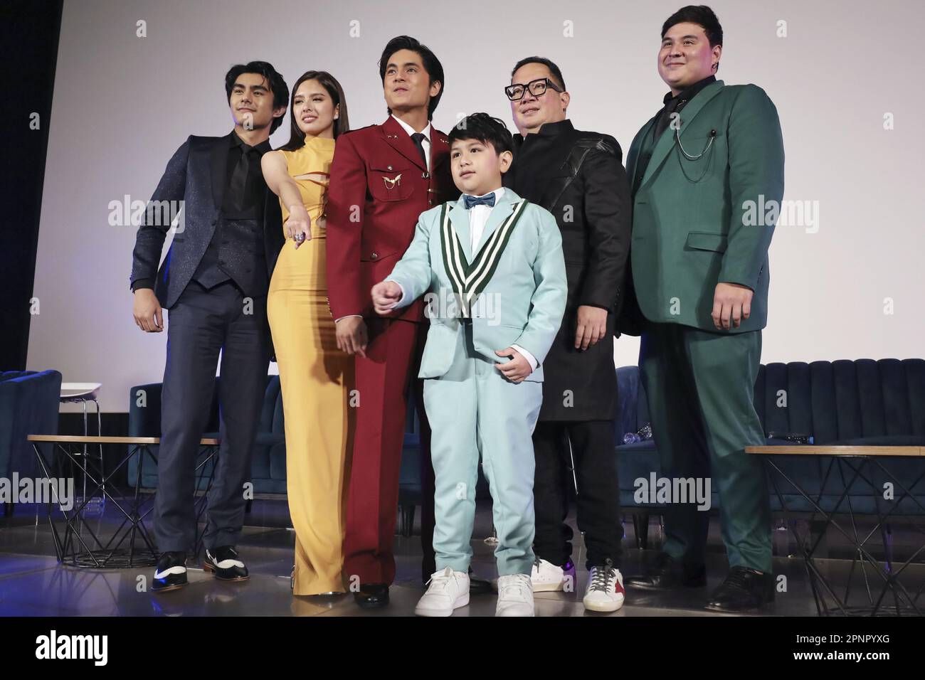 Film director Mark Reyes (2nd from R) poses for a photo at a theater in ...