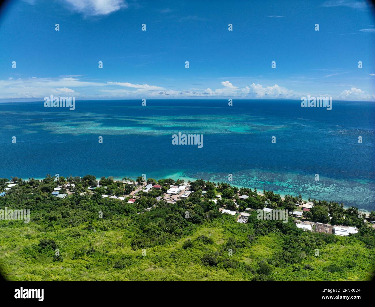 Aerial view of tropical island with clear blue water in Torres Strait ...