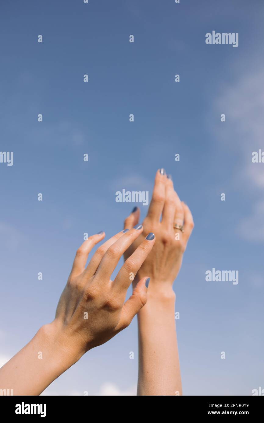 Womens hand reaching up hi-res stock photography and images - Alamy