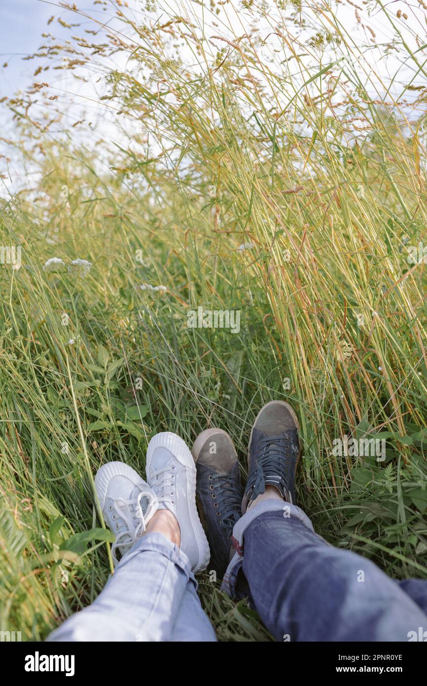 Woman lying on back legs up hi-res stock photography and images - Alamy