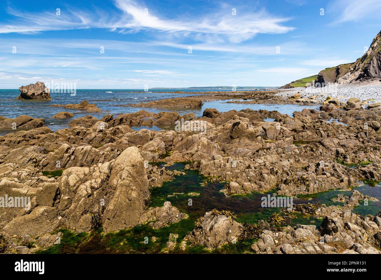 Scenic, Low Tide View of Greencliff Beach, With Pebbles, Exposed Rocks ...