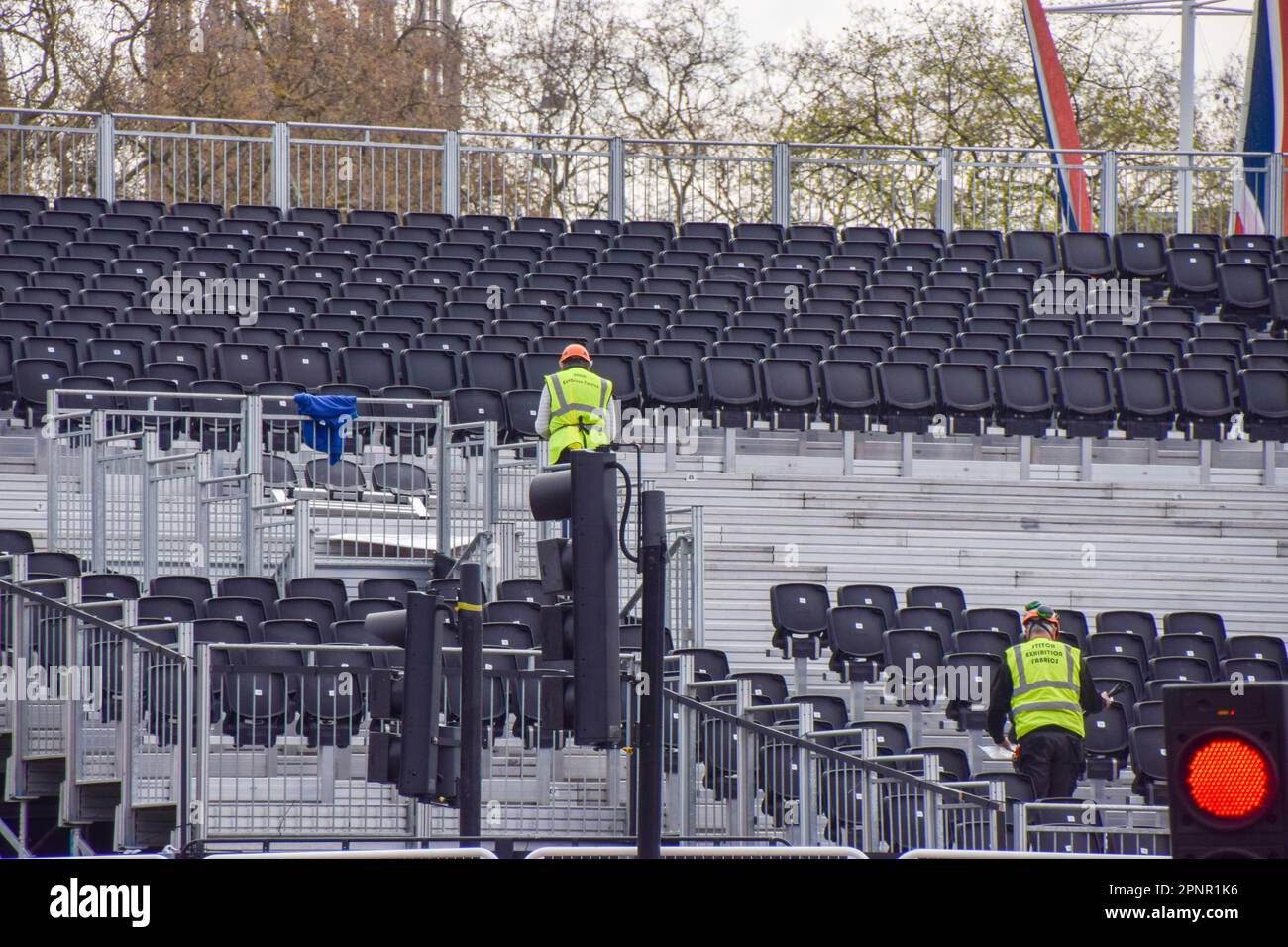 London, UK. 20th April 2023. Workers install seats outside Buckingham ...