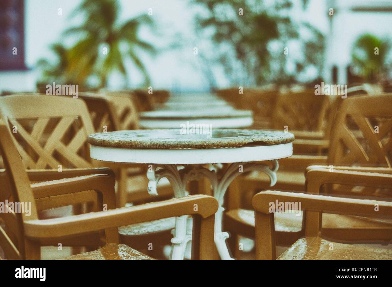 Empty tables and chairs at an outdoor cafe, Jamaica Stock Photo - Alamy
