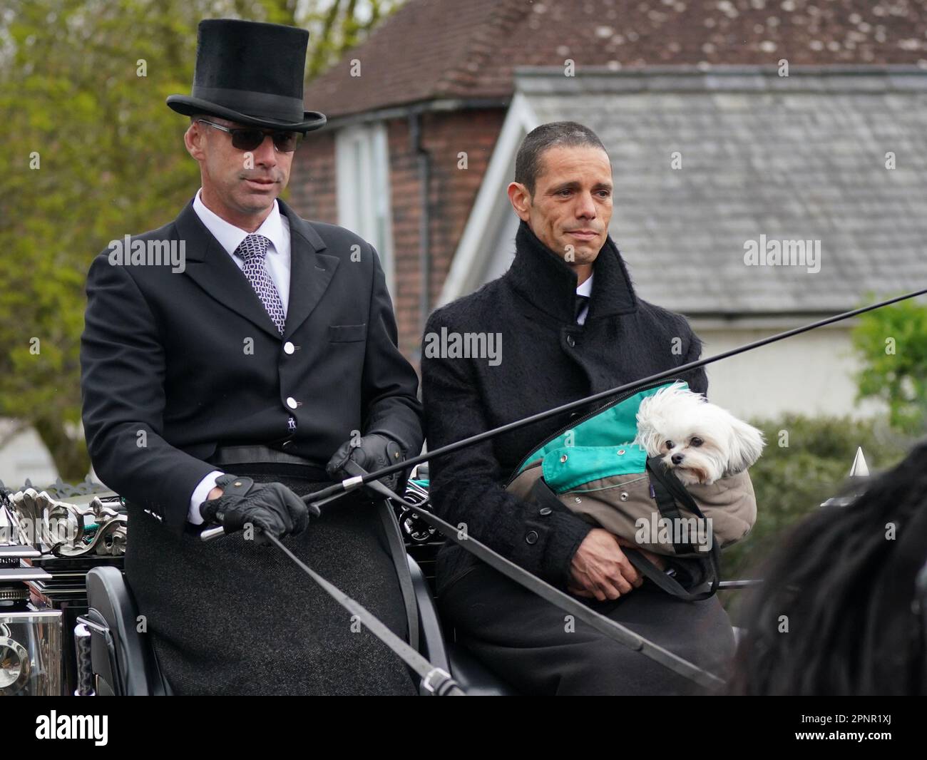 Husband of Paul O'Grady Andre Portasio (right)rides with the funeral ...