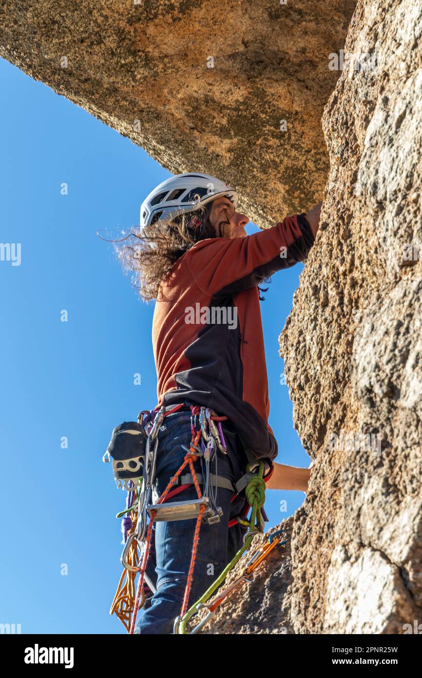 Young adult climbing a granite wall at Torrelodones, Madrid. Rock ...