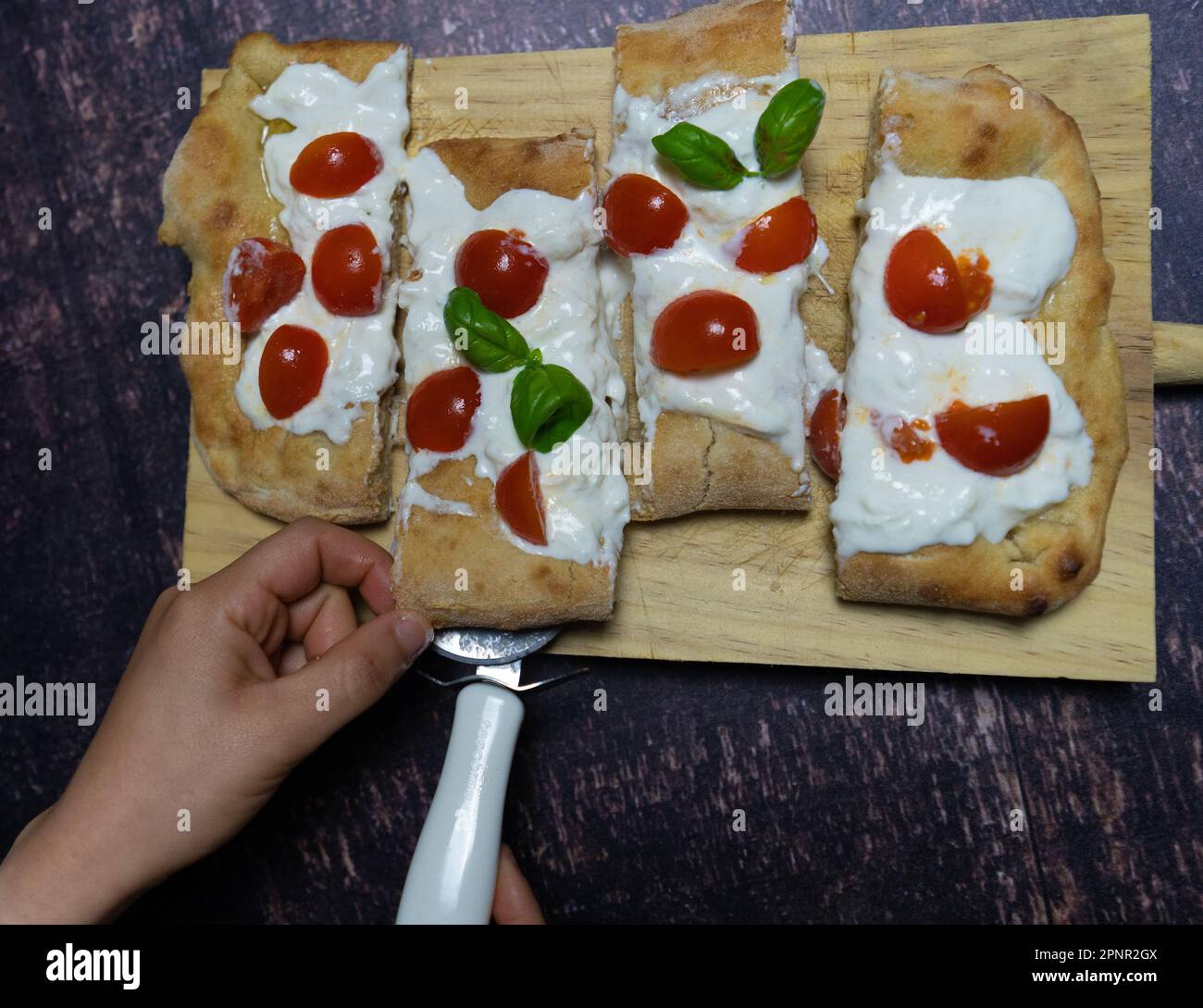 margherita-flavoured Roman pinsa with tomato, mozzarella and basil ...