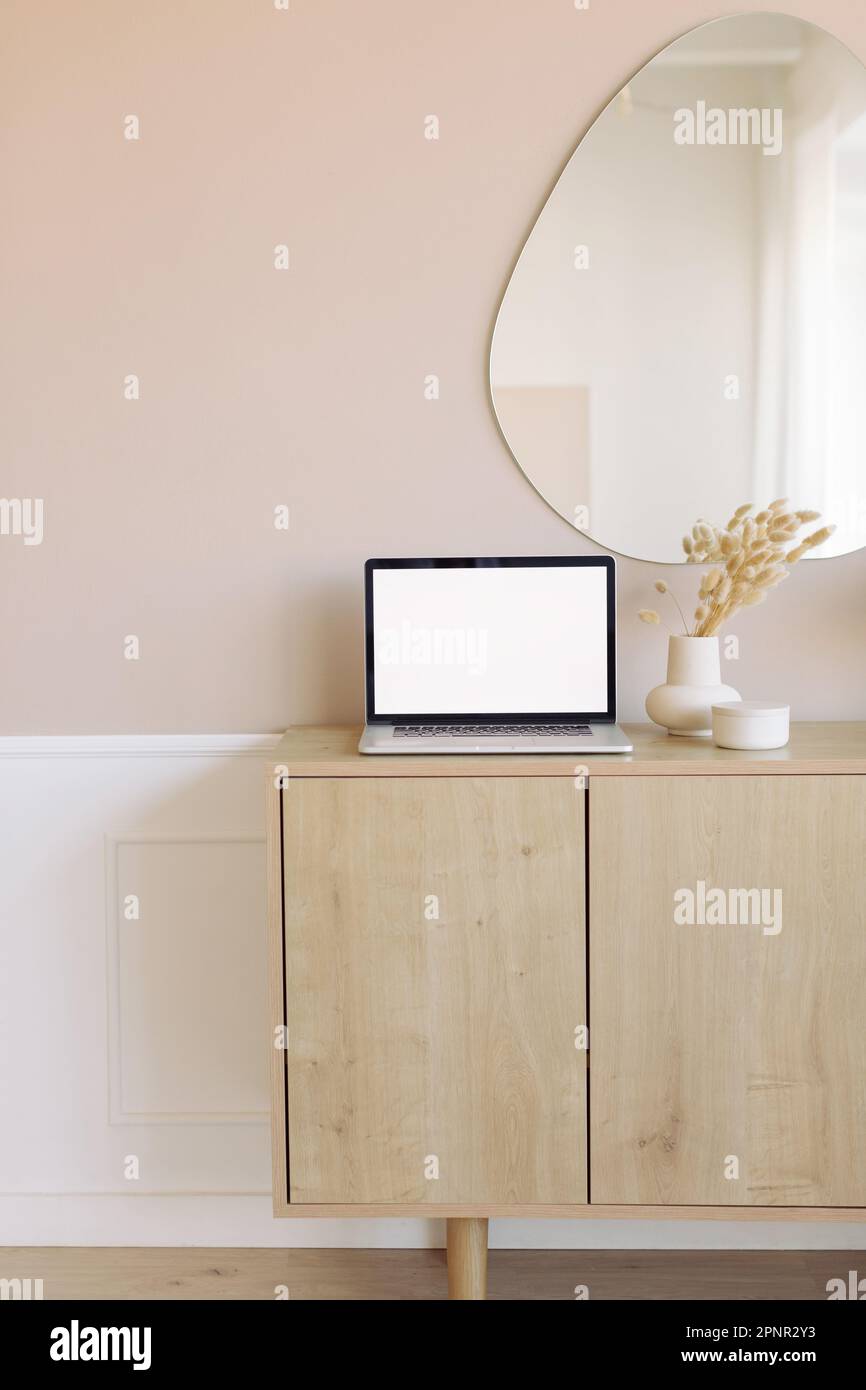 Laptop computer with a blank screen on a sideboard in a house Stock ...