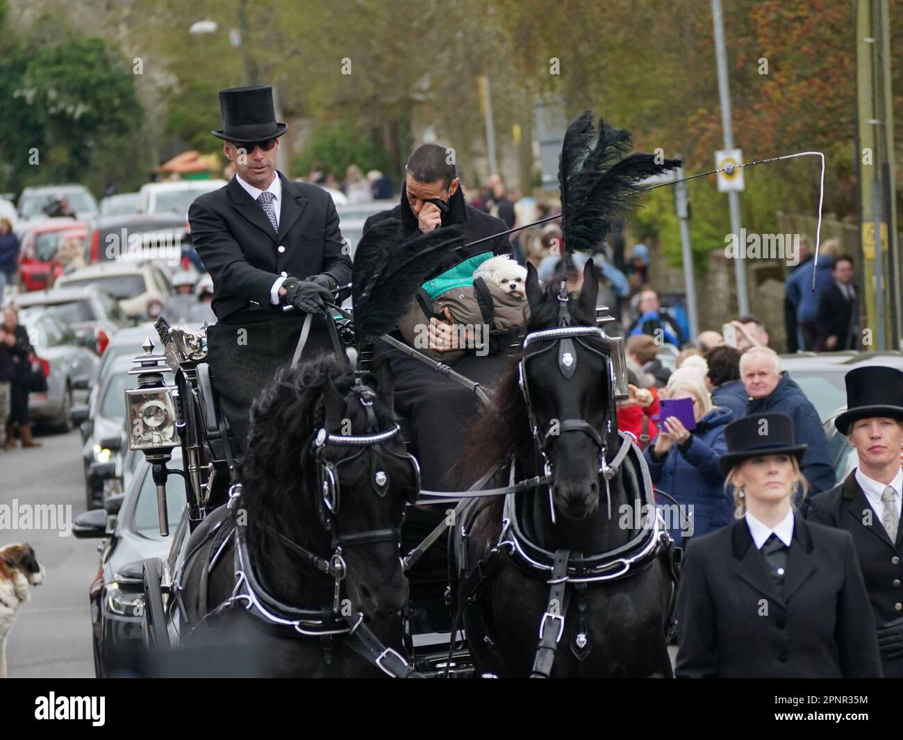 Husband of Paul O'Grady Andre Portasio (right)rides with the funeral ...