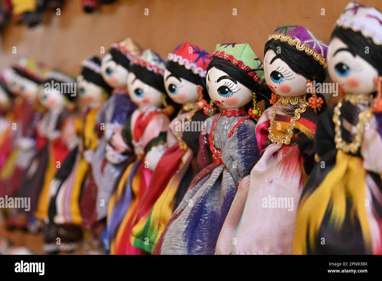 Souvenirs of handmade puppets in a market stall in Khiva, Uzbekistan ...