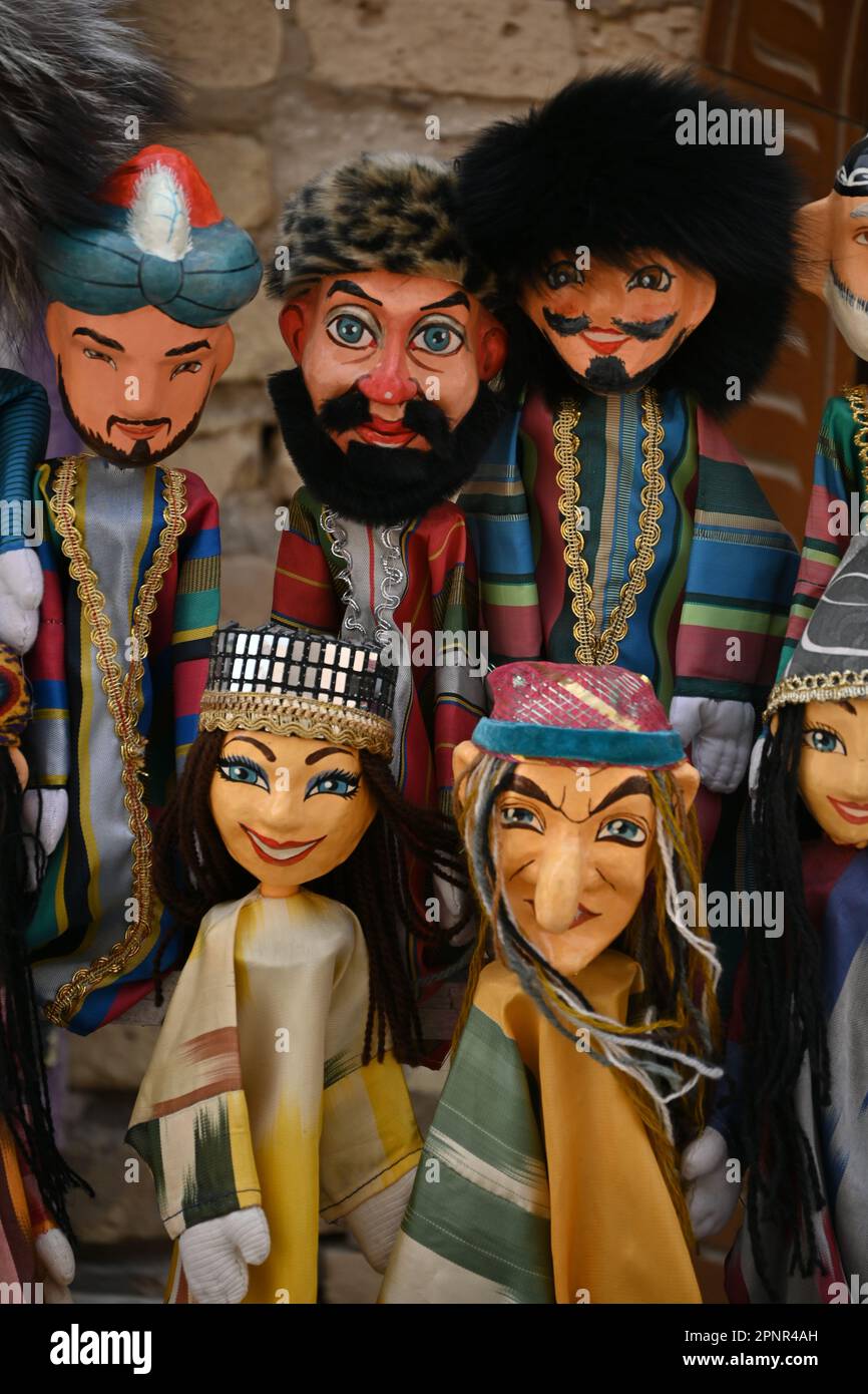 Souvenirs of handmade puppets in a market stall in Khiva, Uzbekistan ...