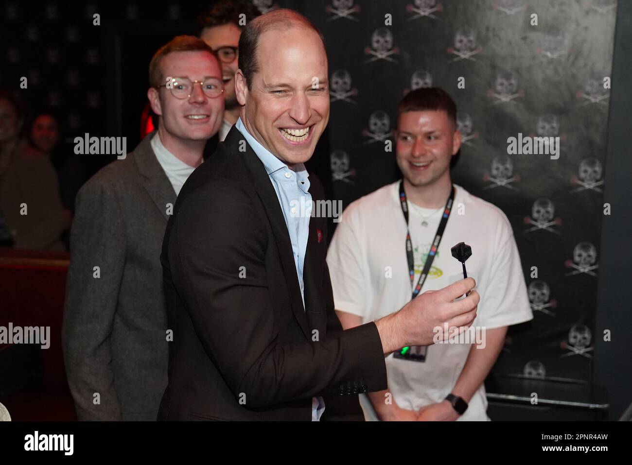 The Prince of Wales takes part in a game of interactive darts in the ...