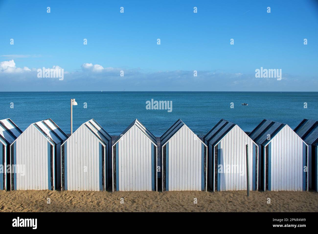 Yport, beach with beach cabins on the blue English Channel Stock Photo ...