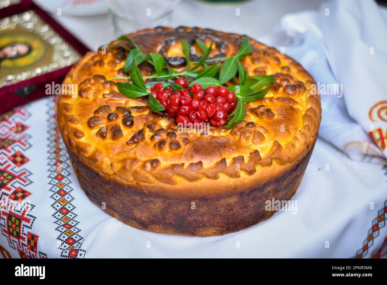 a loaf decorated with viburnum berries. Ukrainian decorated. next to ...