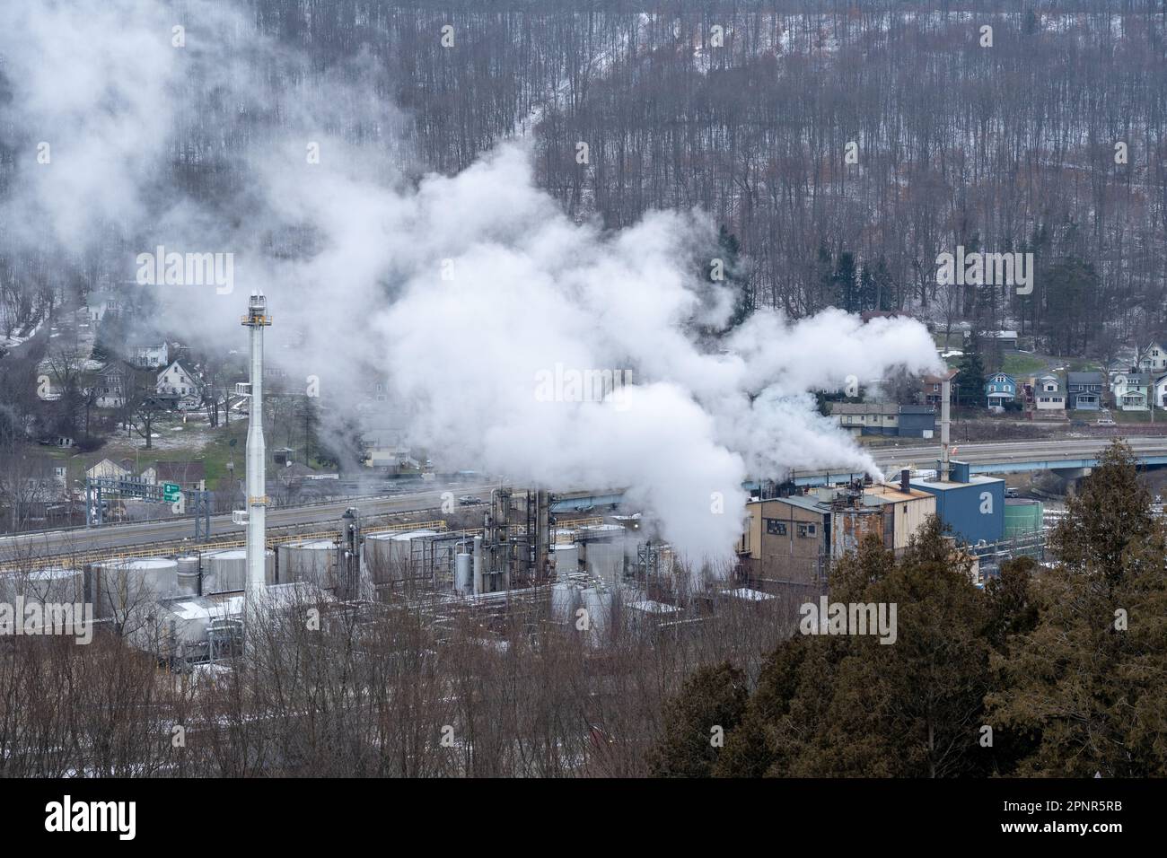 Steam rising from a factory refinery on a cold winter morning Stock ...