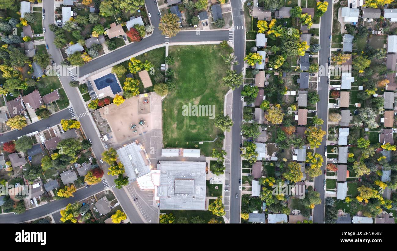 Aerial view of a suburban neighborhood featuring a park and residential ...