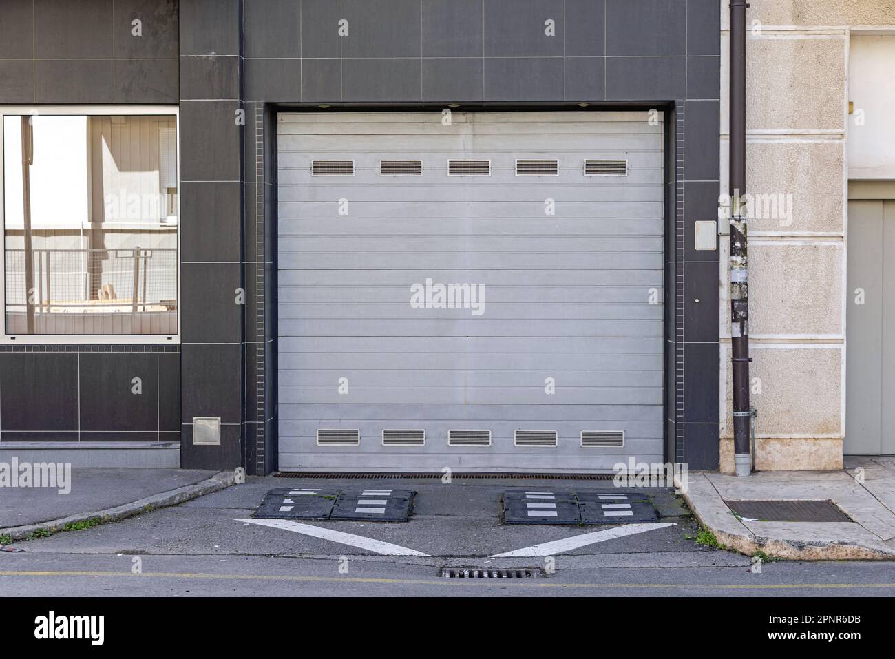 Closed Automated Garage Door Street Entrance for Cars Stock Photo - Alamy