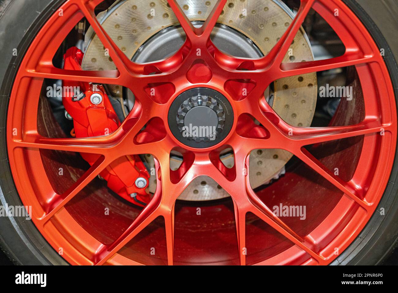 Red Alloy Wheel and Brake Caliper at Sports Car Stock Photo - Alamy