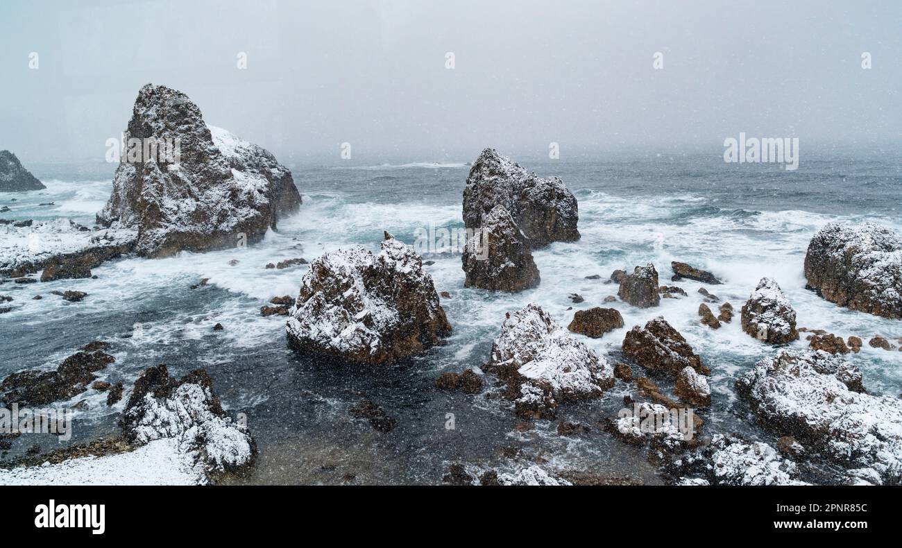 The rocky Sea of Japan coast in winter in Aomori Prefecture, seen from ...