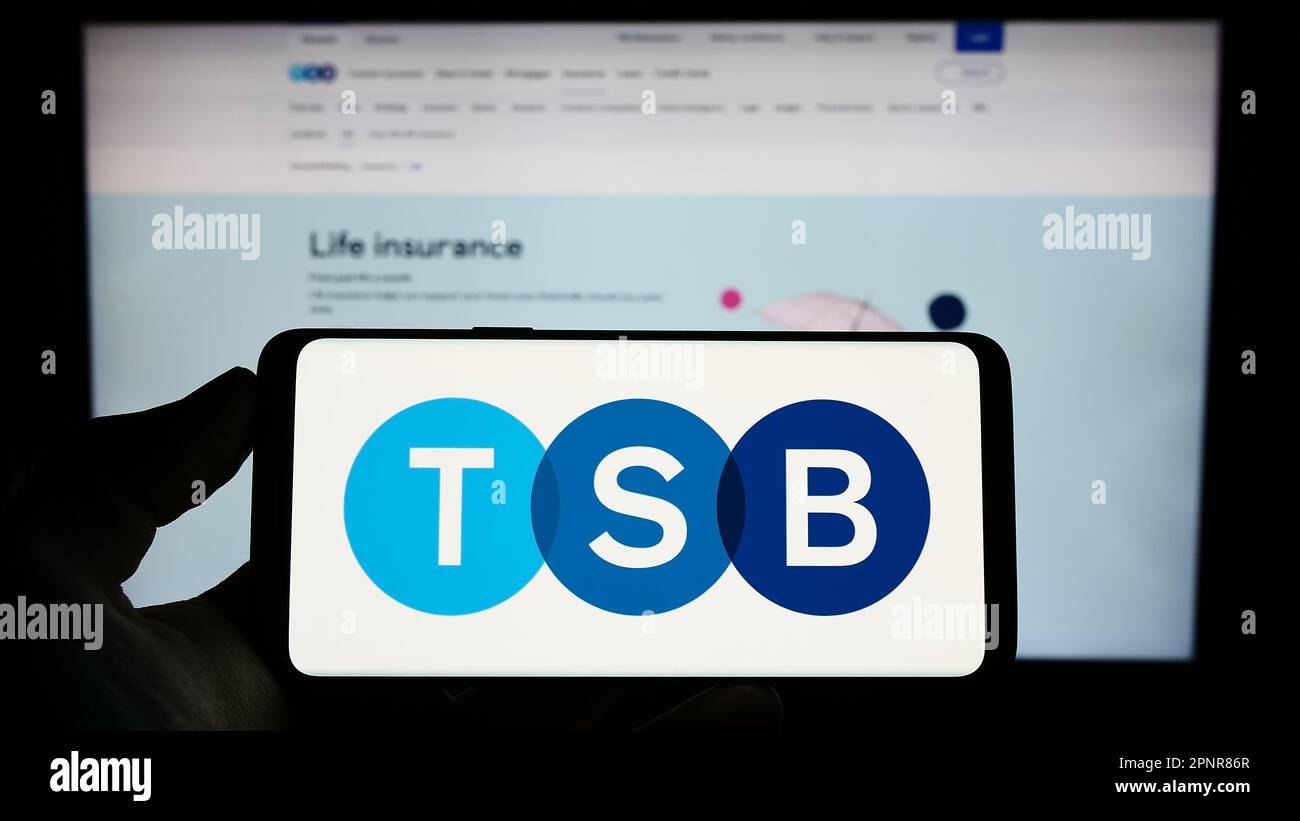 Person holding cellphone with logo of British financial company TSB ...