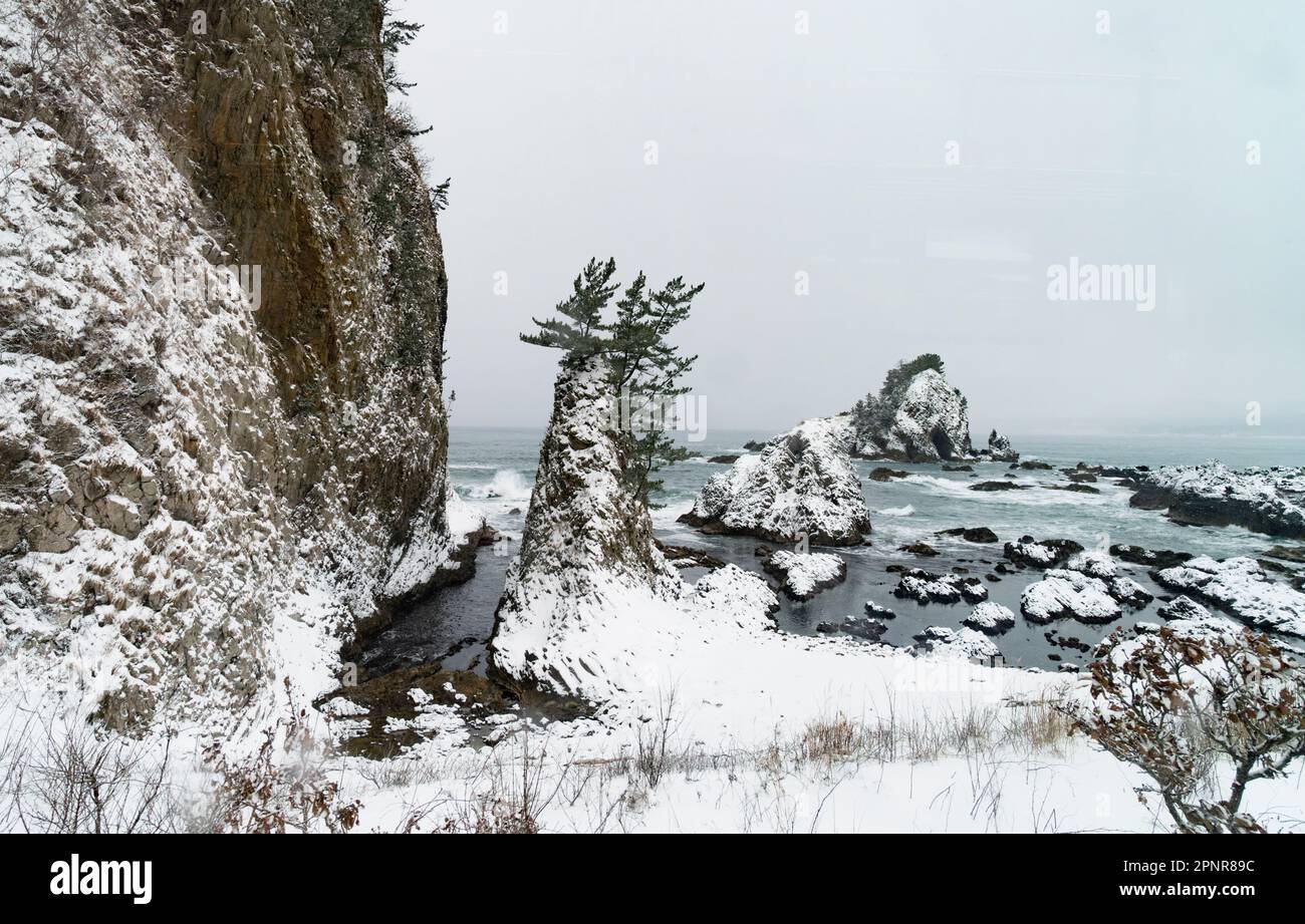 The rocky Sea of Japan coast in winter in Aomori Prefecture, seen from ...