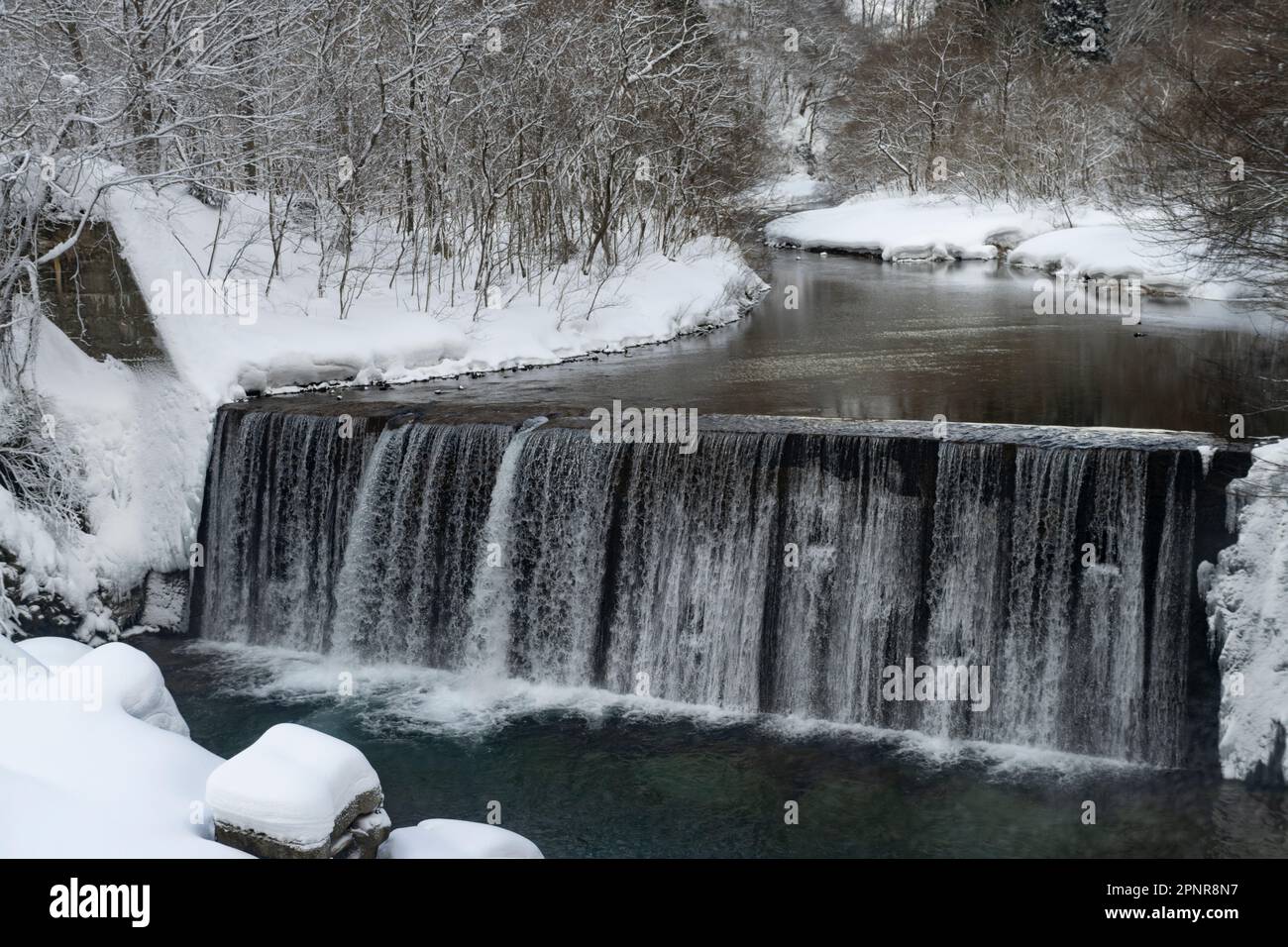 A dam on the Obonai River in Akita Prefecture, Japan, seen in winter ...