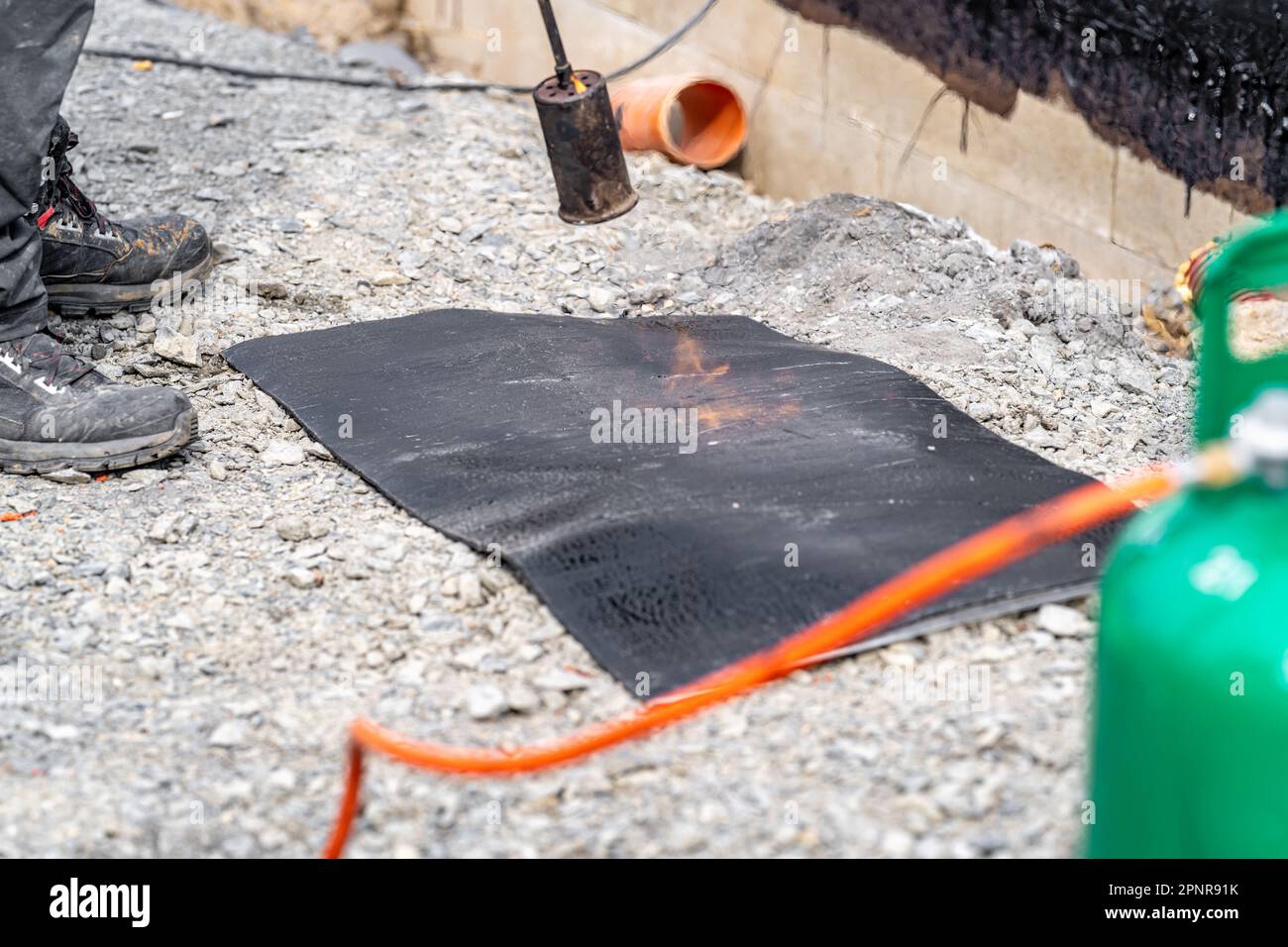 installation of protective waterproofing on the foundation and walls of ...