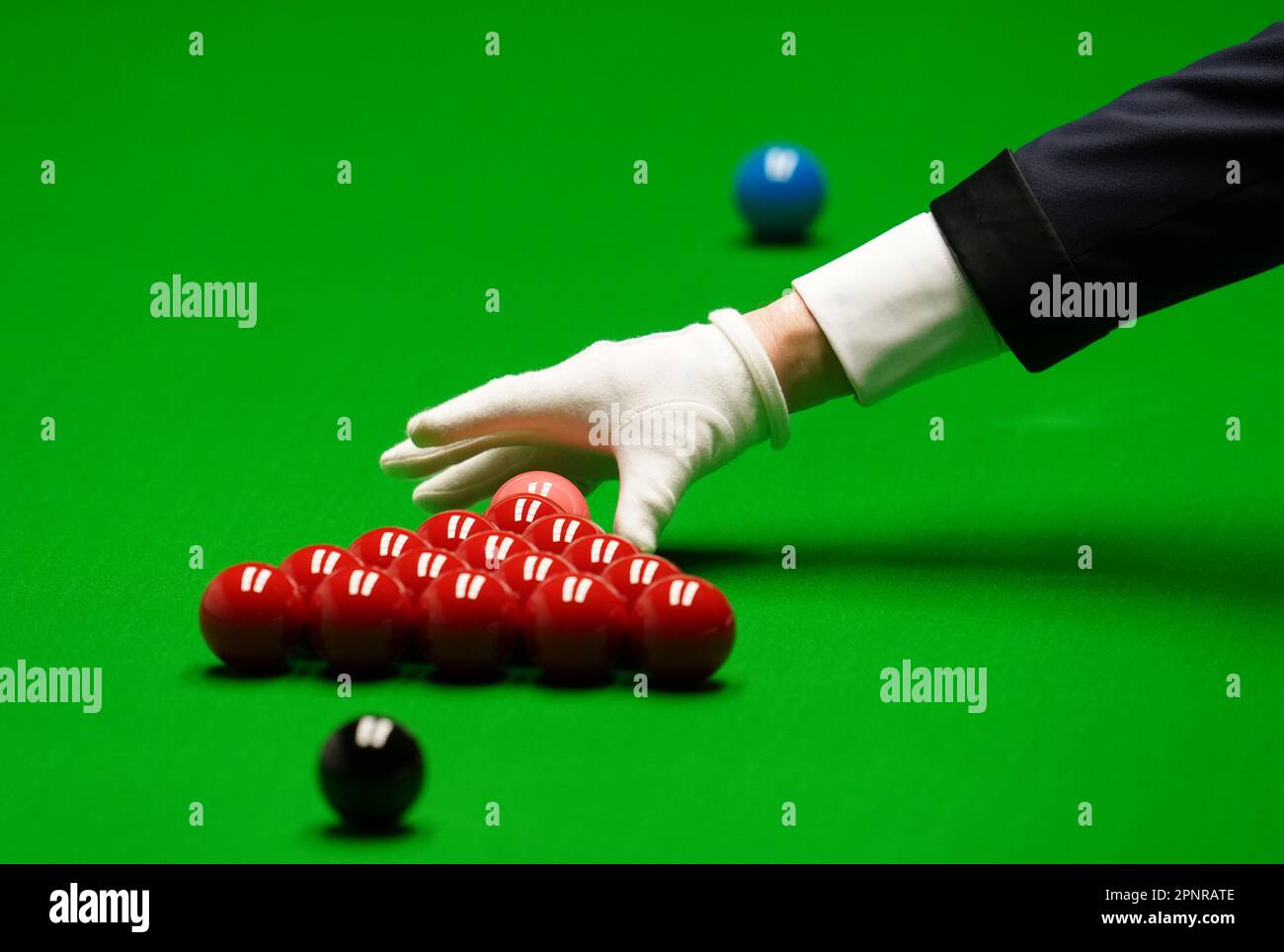 Snooker referee respots the yellow at the start of new frame during day ...