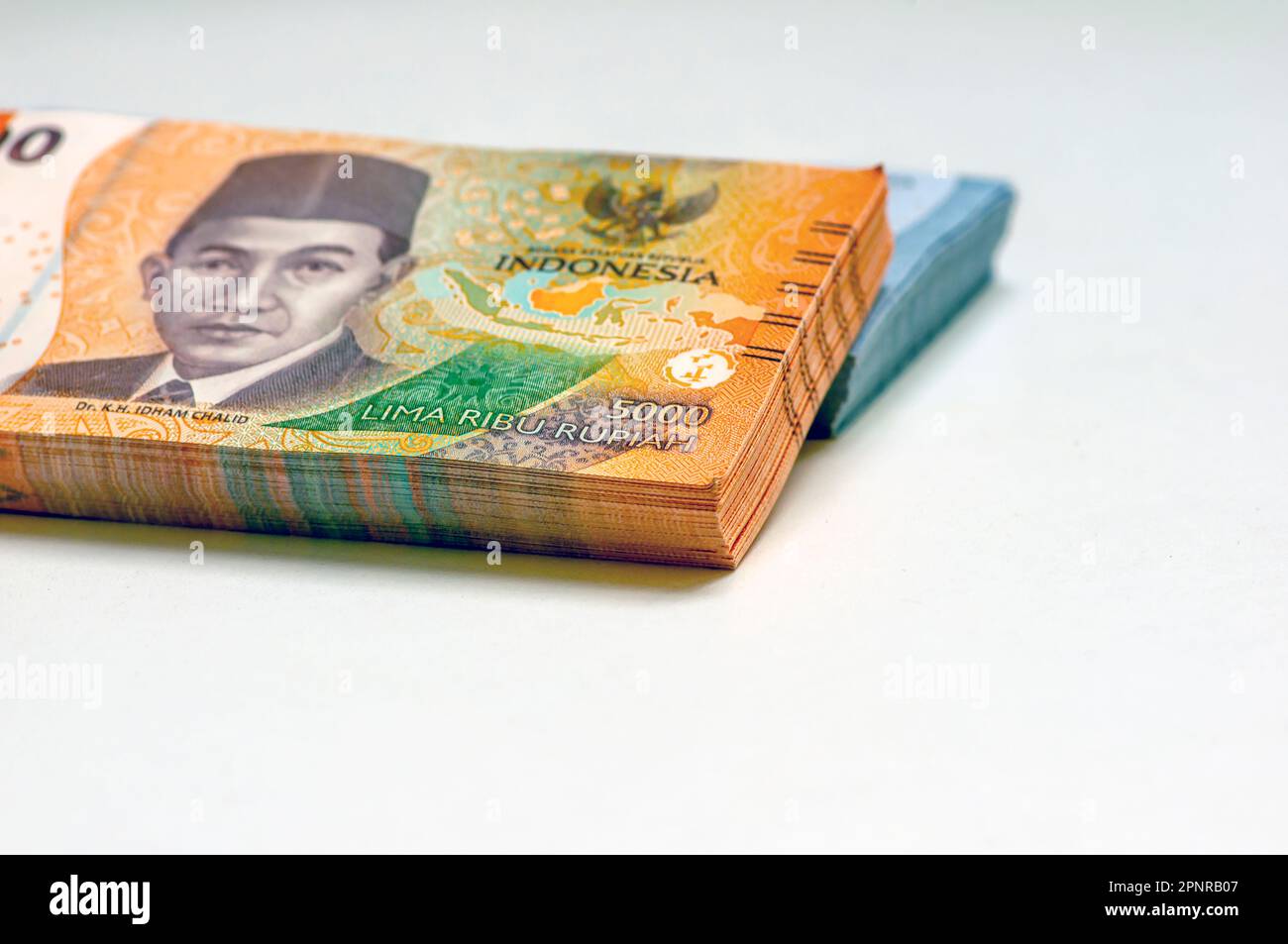 Indonesian money currency, Rupiah, in selected focus Stock Photo - Alamy