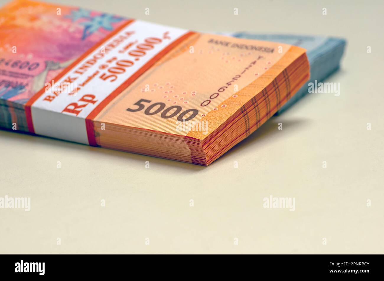 Indonesian money currency, Rupiah, in selected focus Stock Photo - Alamy