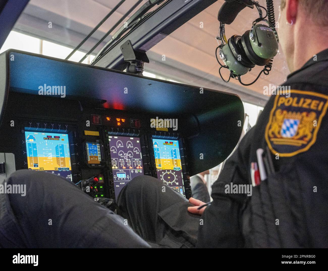 SCREENSHOT - 20 April 2023, Bavaria, Donauwörth: A police pilot sits in ...