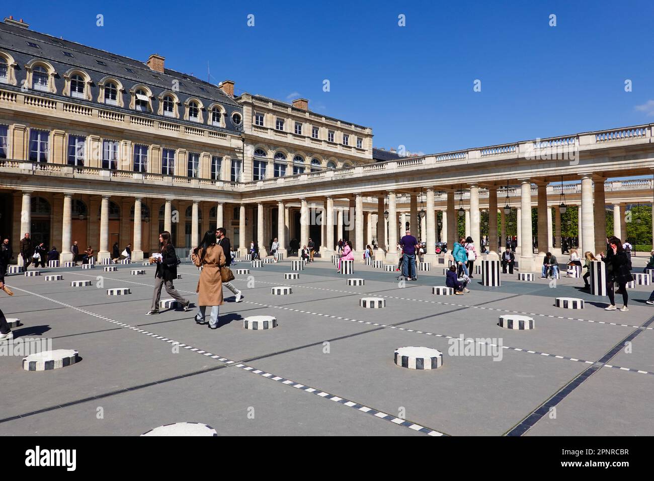 Palais Royal, 17th-century arcaded palace with gardens, people in ...