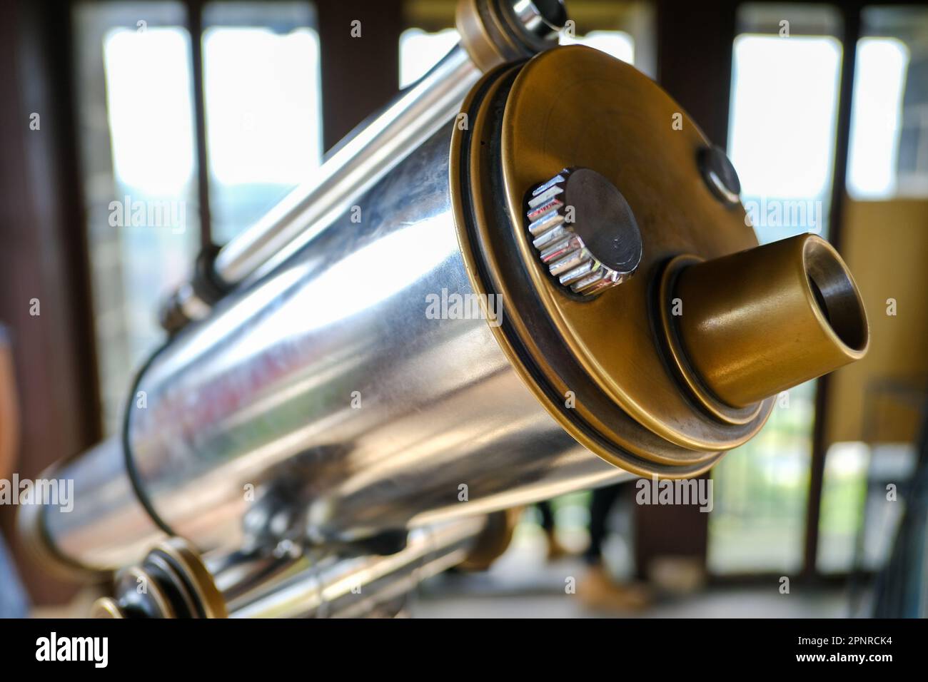 A telescope is mounted on top of an observation tower for watching the ...