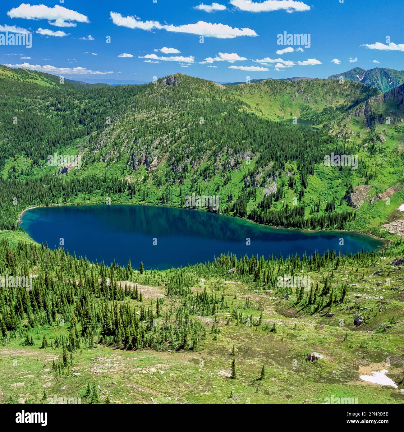 heart lake (and distant pearl lake) in the bitterroot mountains below ...