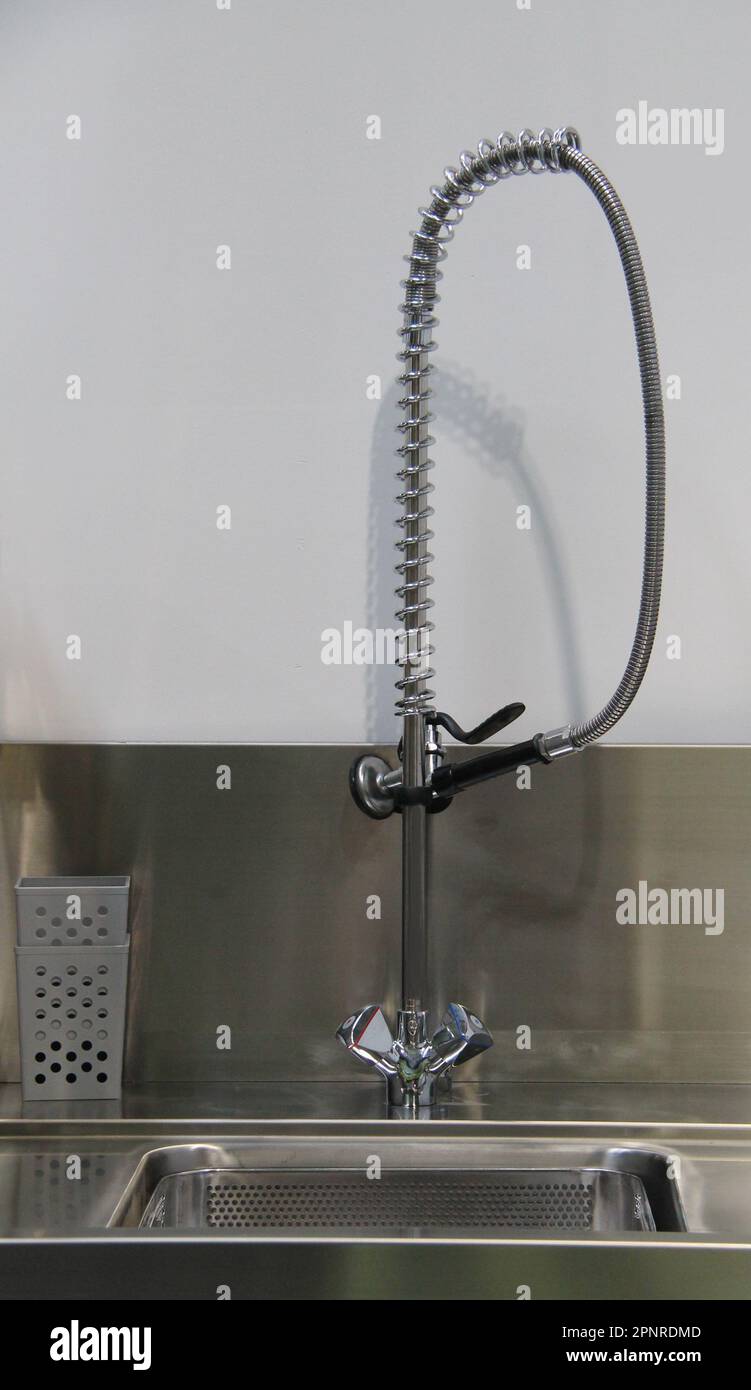 A Vertical Mixer Tap on a Stainless Steel Sink Unit Stock Photo - Alamy