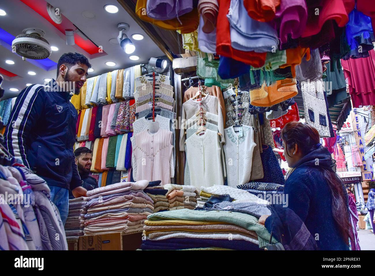 A Kashmiri woman shops ahead of the Muslim festival Eid al-Fitr in ...
