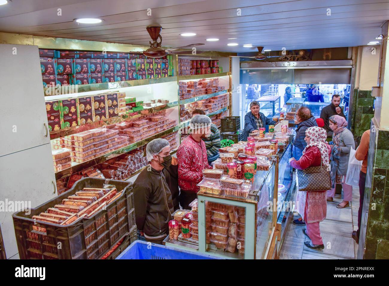 Kashmiri Muslims shop at a bakery store ahead of the Muslim festival ...