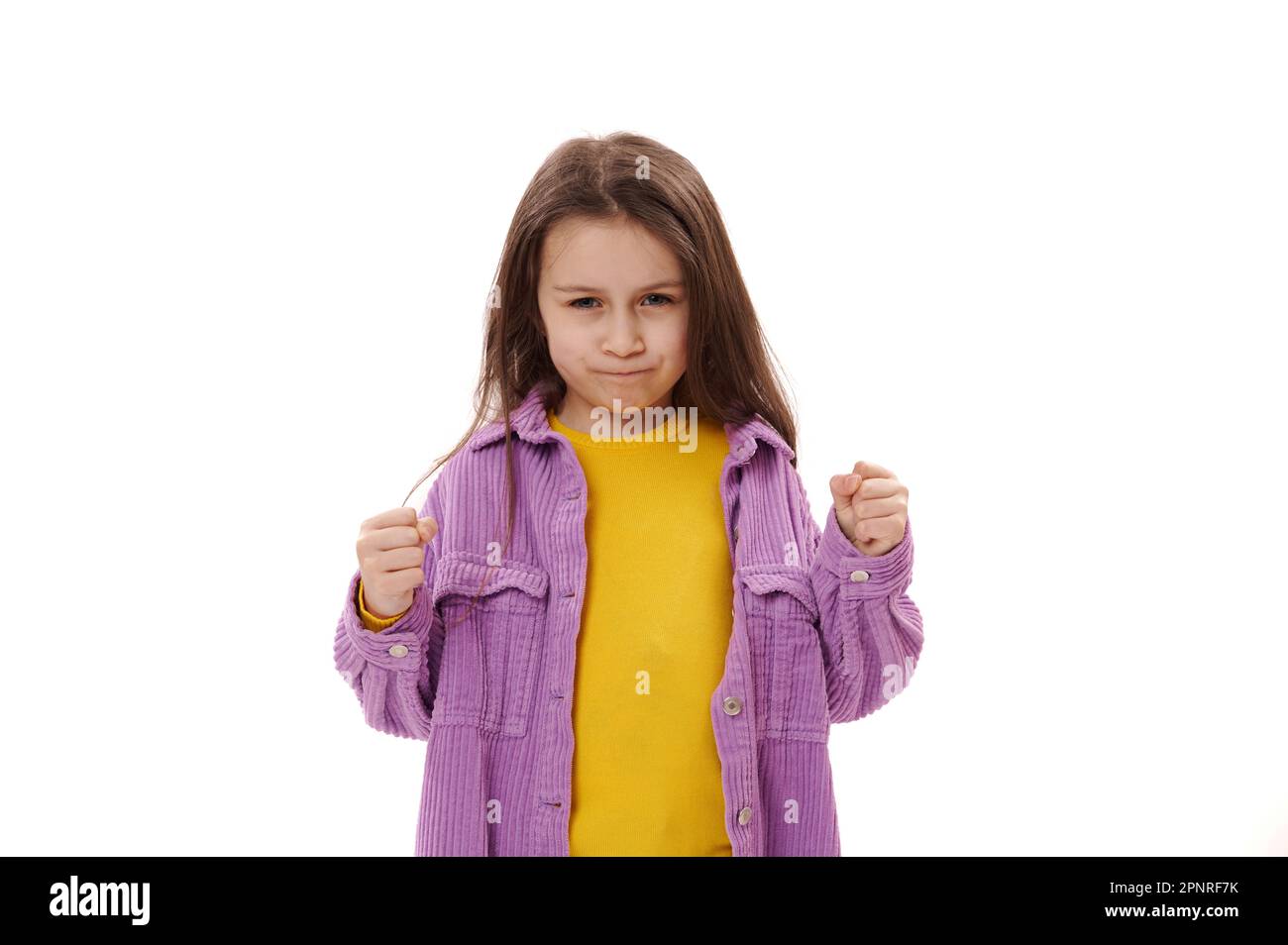 Curious angry little child girl clenching fists, expressing negative ...